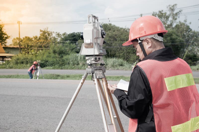 Surveyor Or Engineer Setting Measure Prism Reflector On The Highway ...