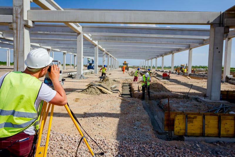 Civil Engineer, Geodesist is Working with Total Station on a Bui ...