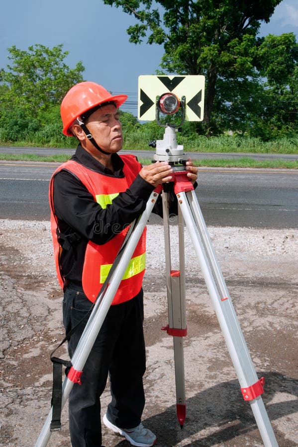 Surveyor or Engineer Setting Measure Prism Reflector on the Highway ...