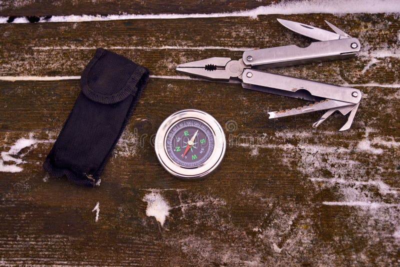 Compass and Multitool with Case on the Wood Stock Image - Image of ...