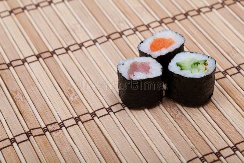 Sushi on bamboo mat stock photo. Image of restaurant - 27161170