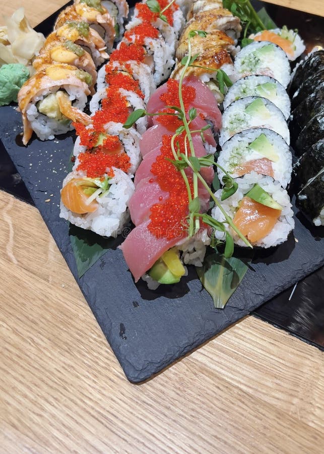 In the Sushi Bar, Delicious Sushi of Various Types is on the Plate ...