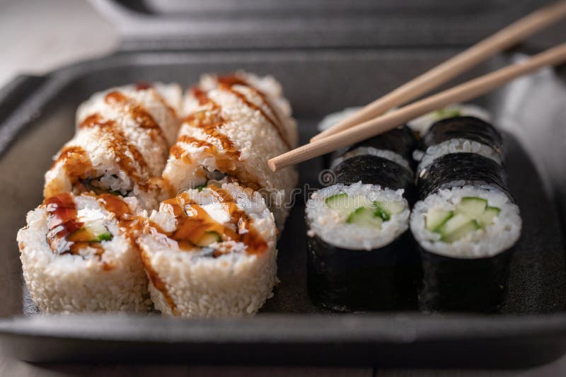 Sushi or Bento Box with Assorted Sushi Rolls Pieces. Fish Food ...