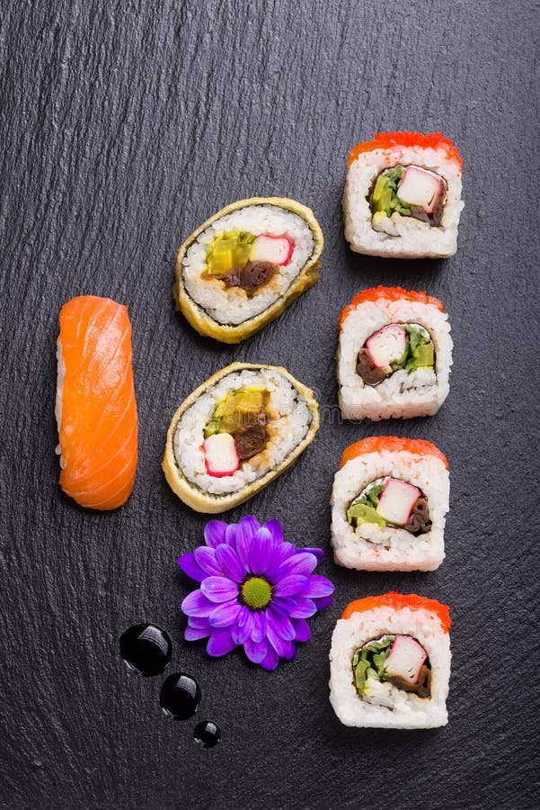 Sushi on black stone plate stock image. Image of cuisine - 50334583