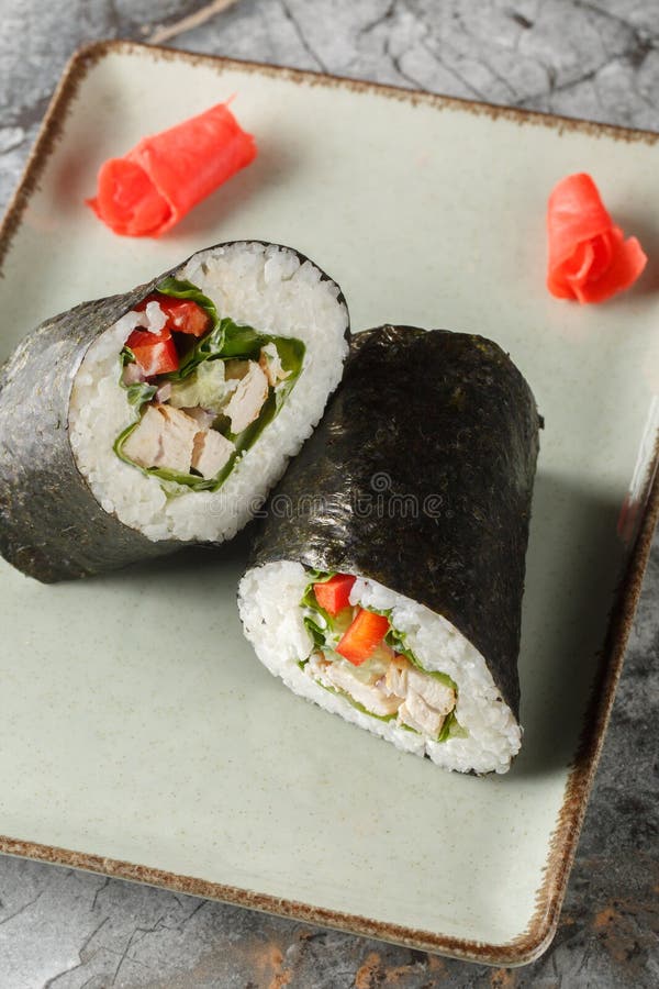 Sushi Burrito with Rice, Chicken, Vegetables and Lettuce Close-up in a ...