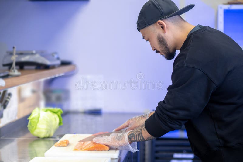 Sushi Chef Cutting Fish and Making Sushi Stock Photo - Image of ...