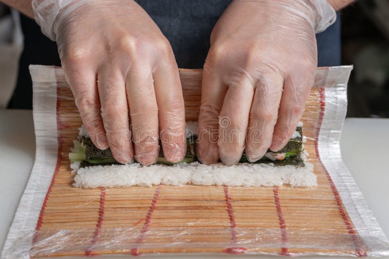 Sushi Chef Rolls the Roll Using a Mat Stock Image - Image of sushi ...