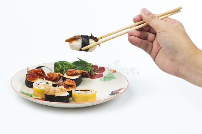 Sushi with Chopsticks, Picked by Hand. Stock Photo - Image of sashimi ...