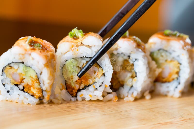 Sushi with chopsticks stock photo. Image of japanese - 66757136