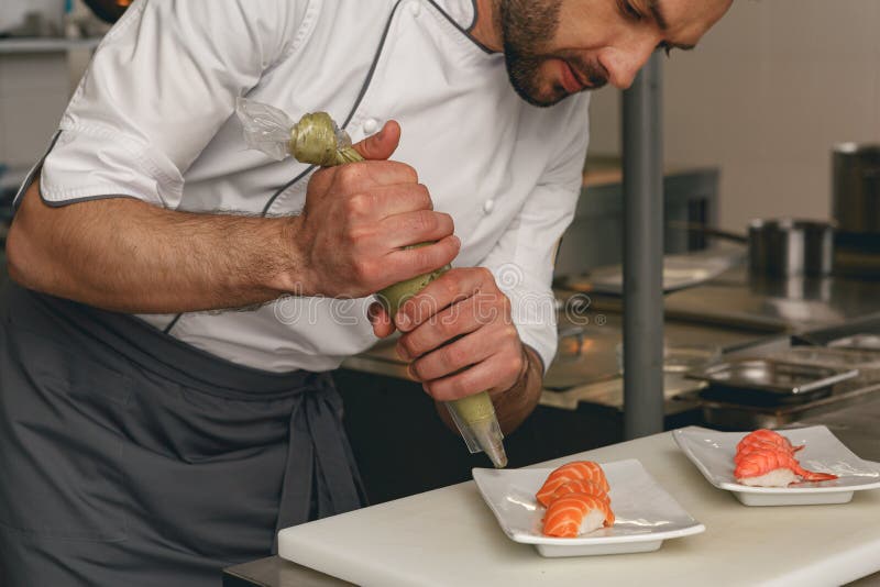 Sushi Master Prepares Sushi for Serving in Modern Commercial Kitchen ...
