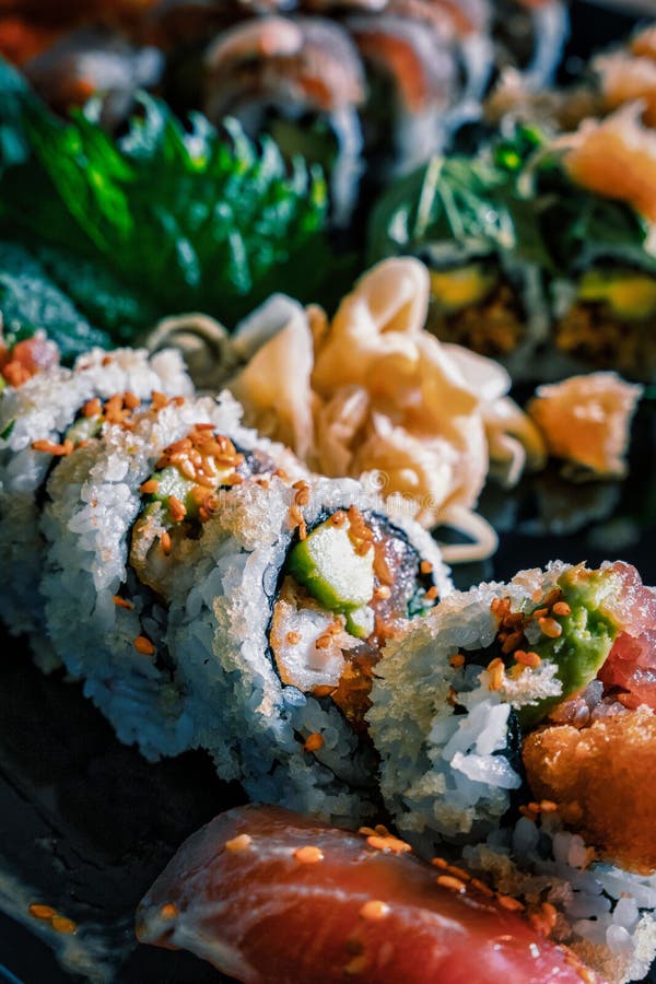 Sushi Plate with Inside-out Rolls in Focus Stock Image - Image of ...