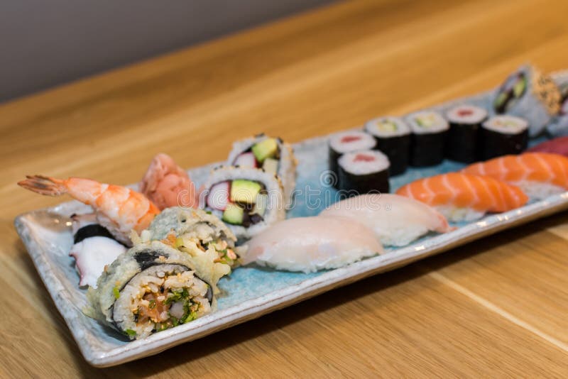 Sushi platter on table stock image. Image of gourmet - 58712125