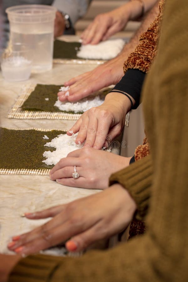 Sushi Roll Being Made in a Demonstaration Class and Students ...