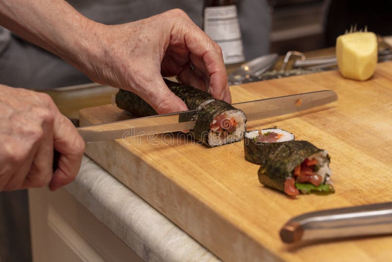 Sushi Roll Being Sliced in a Demonstaration Class Stock Image - Image ...