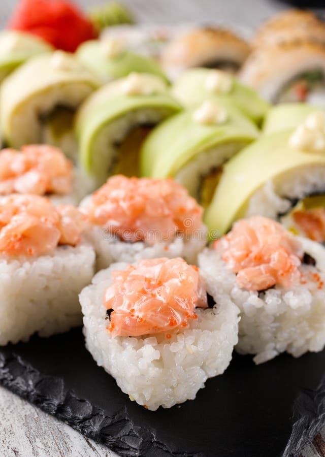 Sushi Roll Covered with Chopped Salmon and Caviar is Served on ...