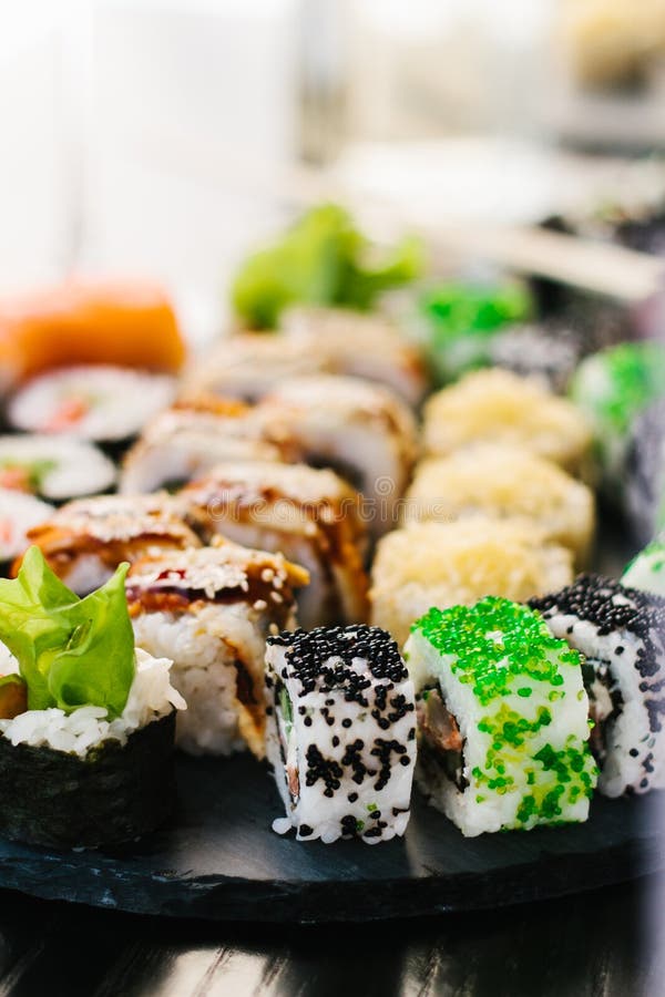 Sushi Roll Different Set on a Slate Plate and Table Stock Image - Image ...