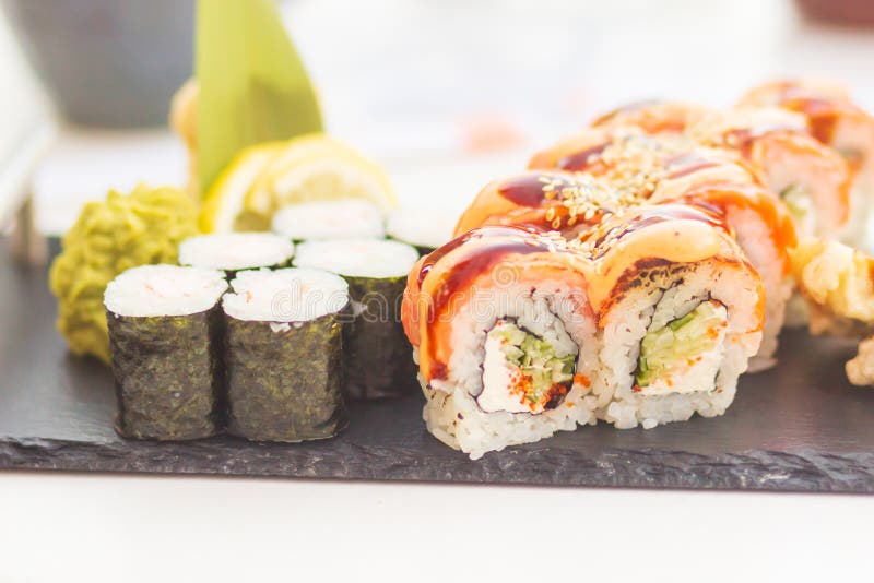 Sushi and Sushi Roll Set on Black Stone Table Stock Photo - Image of ...