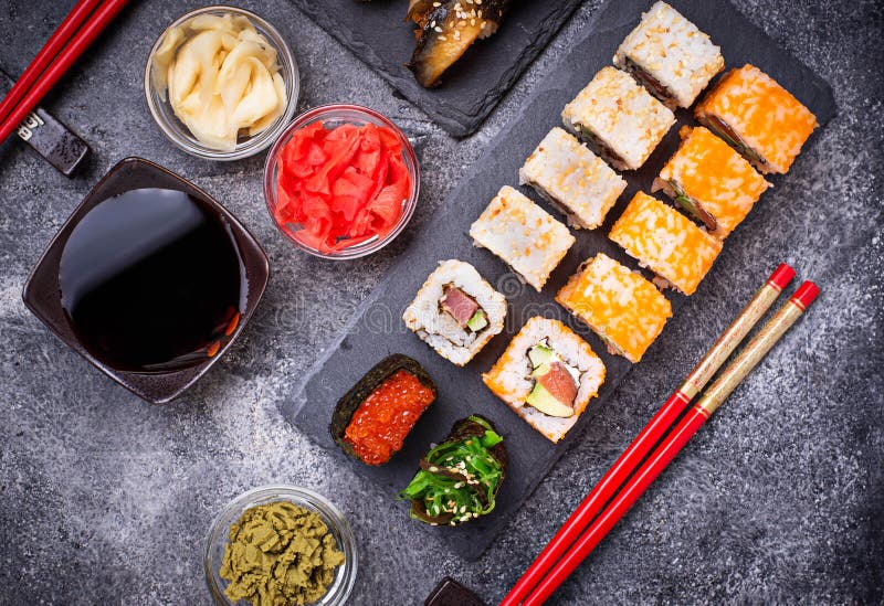 Sushi and Roll Set on Black Table Stock Image - Image of pink ...