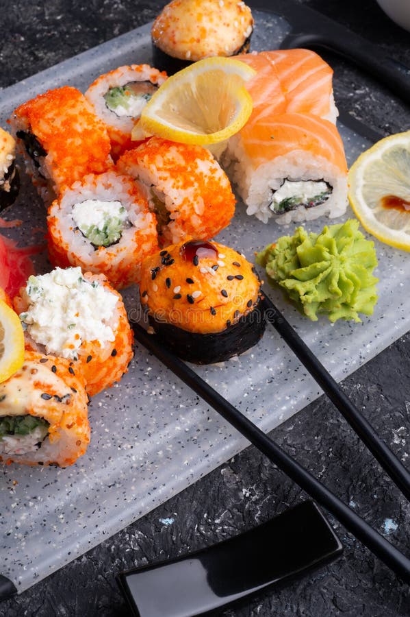 Sushi Roll Set Served at Grey Tray at Black Table. Flat Lay Stock Image ...