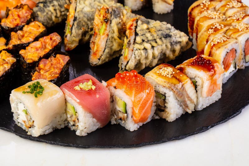 Sushi and rolls mix stock photo. Image of roll, plate - 124569600