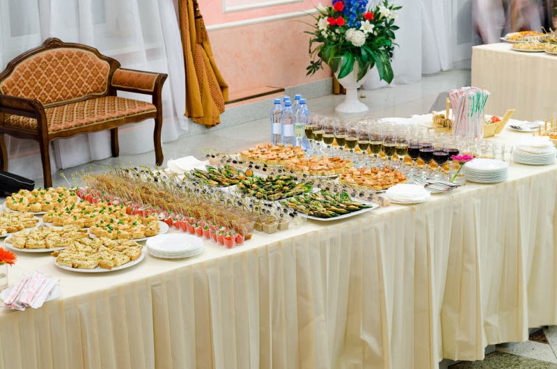 Buffet Table Full of Food in Small Dishes and a Fruit Platter. Stock ...