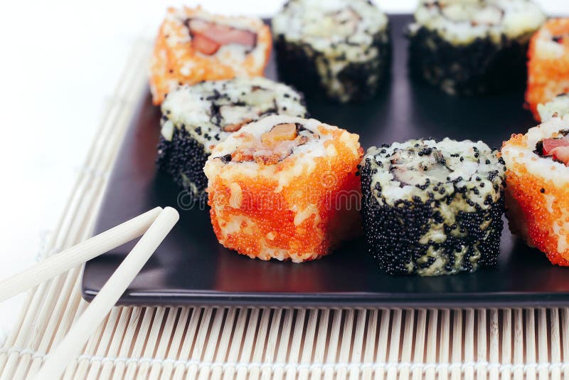 Sushi Set - Different Types of Maki Sushi and Chopsticks on a B Stock ...
