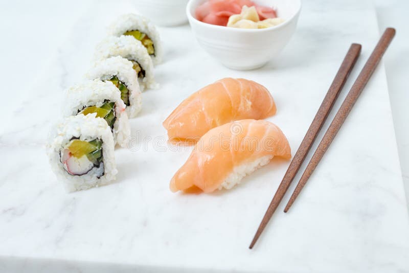 Sushi set on marble board stock photo. Image of dinner - 209932538