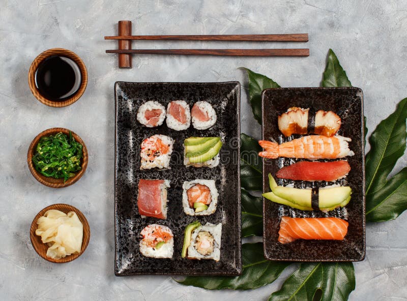 Sushi Set Nigiri and Sushi Rolls on Rectangular Plates Stock Image ...