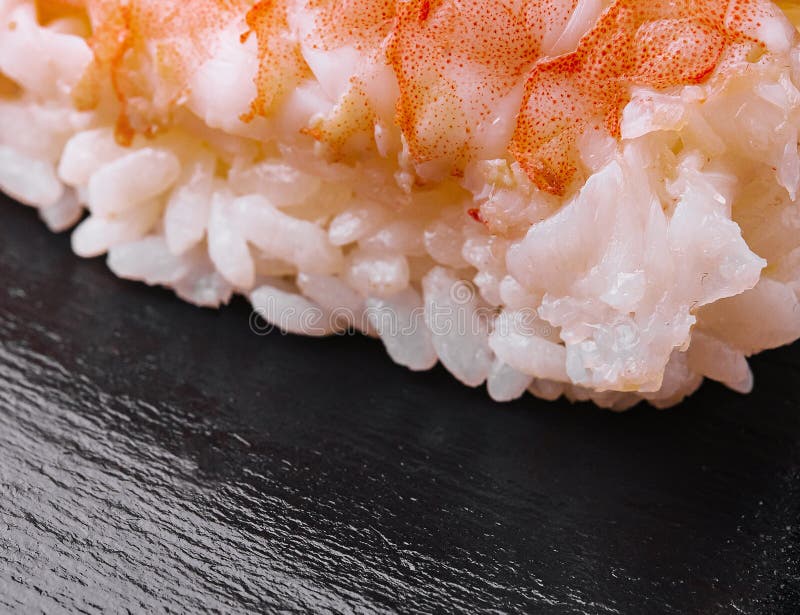 Sushi Shrimp and Rice on a Black Wood Stock Image - Image of black ...
