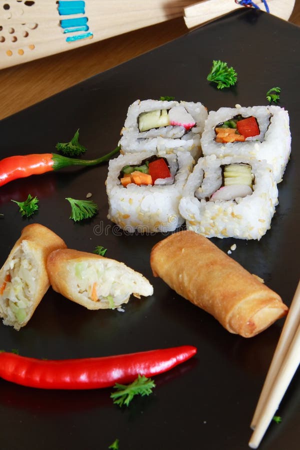Sushi and spring rolls stock photo. Image of chilli, plate - 821424