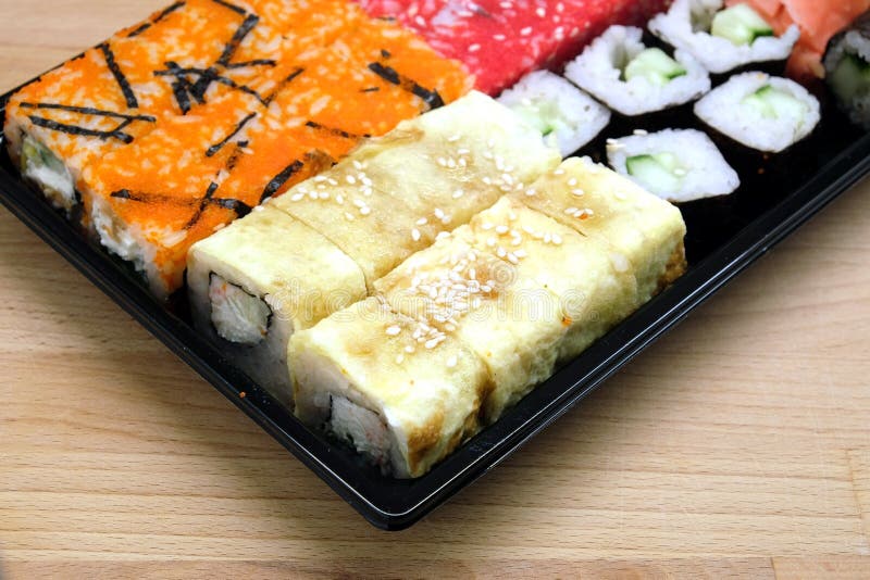 Sushi on Square Tray on Brown Wooden Table Side View Closeup Stock ...