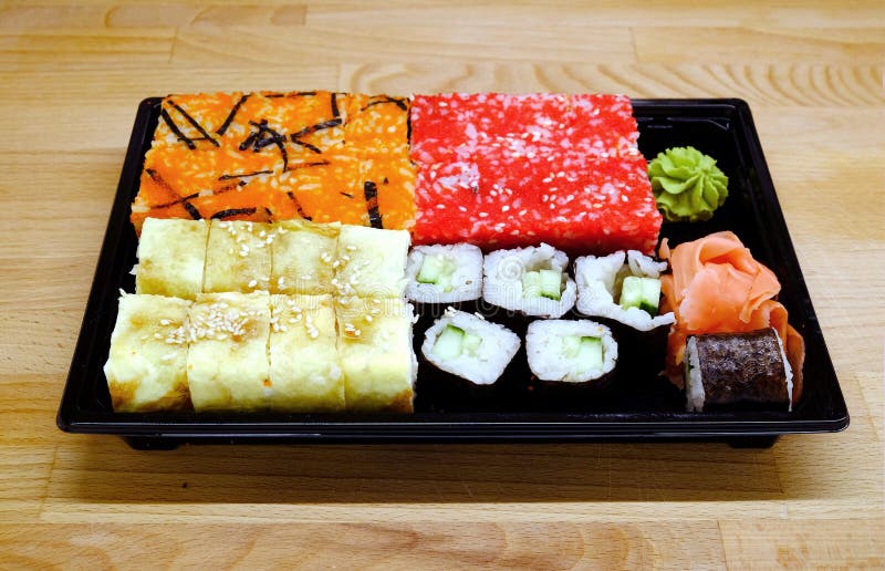 Sushi on Square Tray on Brown Wooden Table Side View Closeup Stock ...