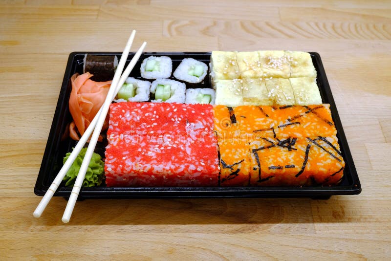 Sushi on Square Tray on Brown Wooden Table Side View Closeup Stock ...