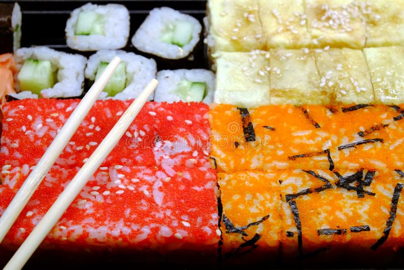 Sushi on Square Tray on Brown Wooden Table Side View Closeup Stock ...