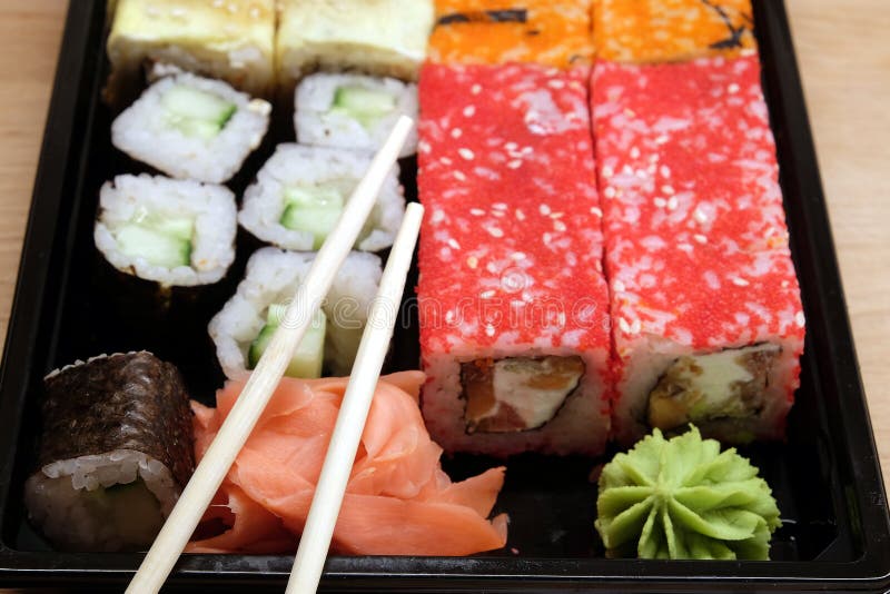 Sushi on Square Tray on Brown Wooden Table Side View Closeup Stock ...