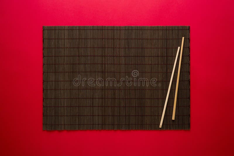 Sushi Sticks and Empty Bamboo Mat on Red Background Stock Image - Image ...