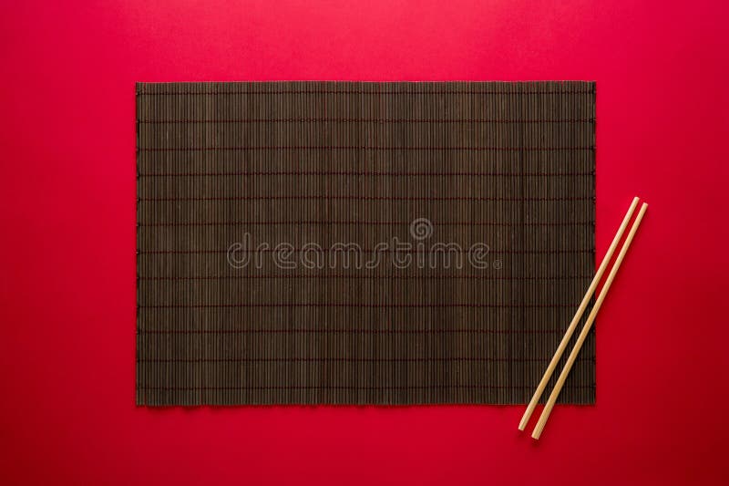 Sushi Sticks and Empty Bamboo Mat on Red Background Stock Photo - Image ...