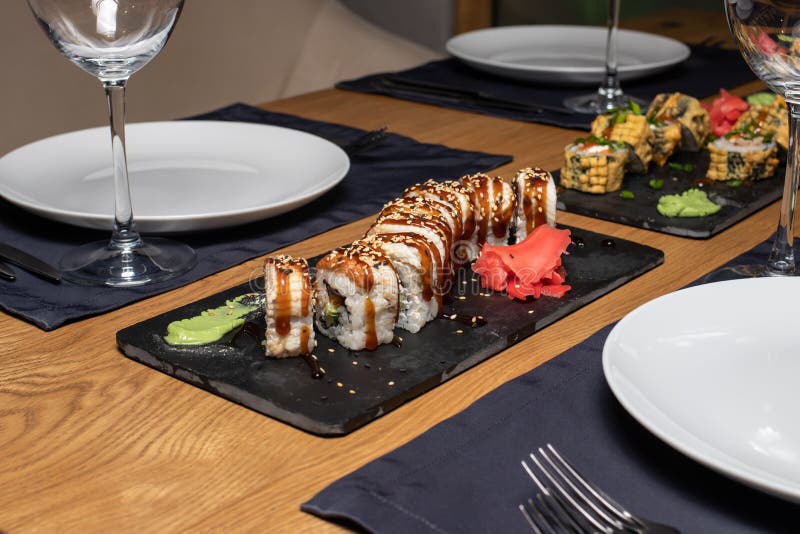 Sushi on the Table in the Restaurant. Served Table with Plates and ...