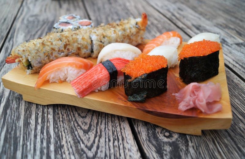 Sushi on wood table stock image. Image of board, dieting - 96057365