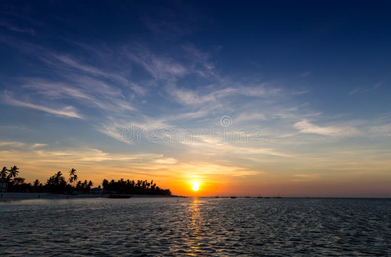 Susnet scene over ocean stock image. Image of beautiful - 144913871