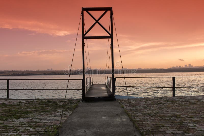 Suspended Bridge Ship Dock and Sunset Stock Photo - Image of elegant ...