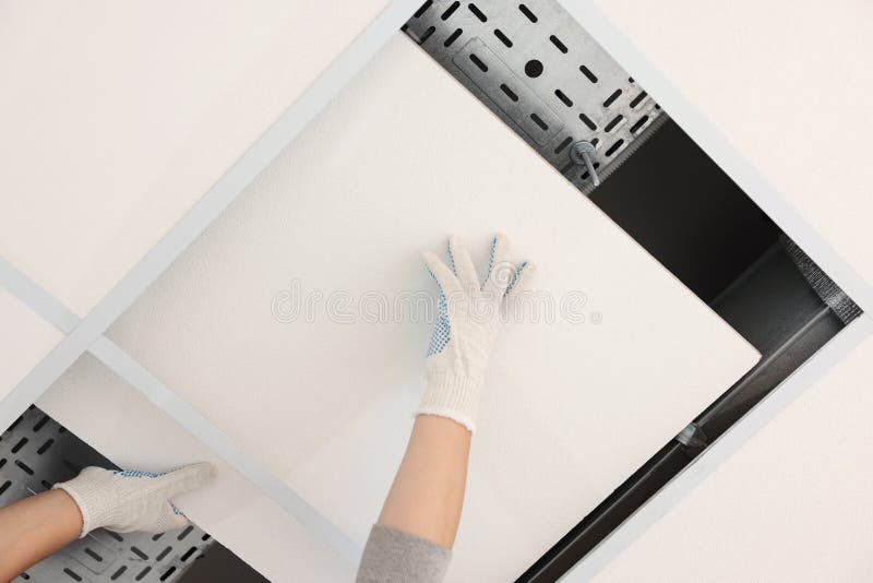 Suspended Ceiling Installation, Bottom View. Builder Working with PVC ...