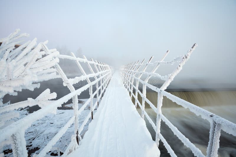 Suspension bridge in frost stock photo. Image of winter - 83739620