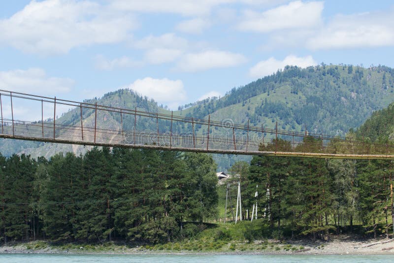 Suspension Bridge in the Mountains Above the River Stock Image - Image ...