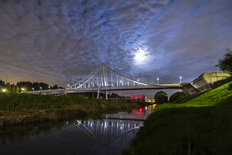 Suspension Bridge at Night Under Moonlight, Reflection in Water Stock ...