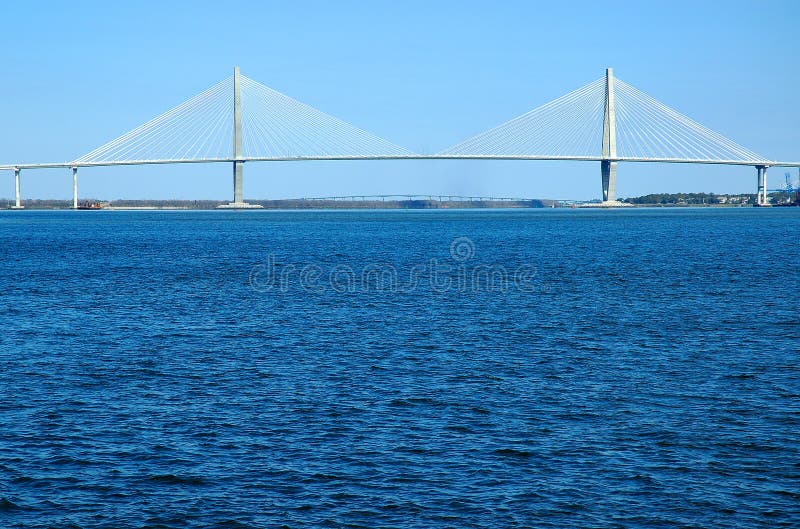 Suspension Bridge Over Water Stock Photo - Image of ravenel, cables ...