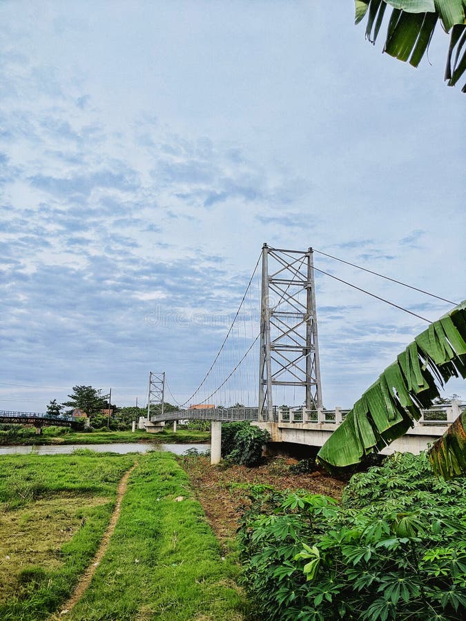 Suspension Bridge Under a Clear Sky Stock Photo - Image of bridge ...