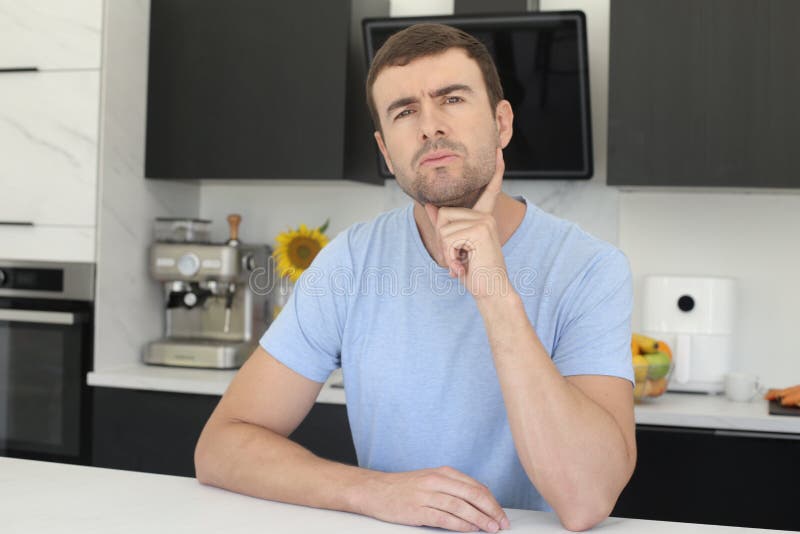 Suspicious Looking Man Thinking in the Kitchen Stock Photo - Image of ...