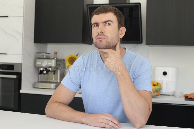 Suspicious Looking Man Thinking in the Kitchen Stock Photo - Image of ...