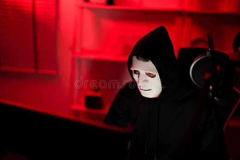 Red Hacker Wearing Black Hoodie and White Face Mask for Phishing Server ...